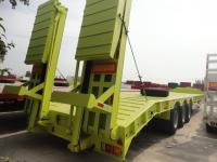 China CIMC HUAJUN 3 Axle Heavy Duty Low Bed Semi Trailer with Hydraulic Ramp Max Payload 70TON for sale
