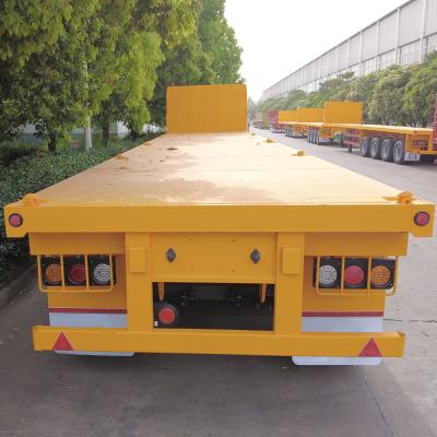 China Africa 4 Axles Semi Trailer 80 Ton Flat Bed for Heavy Duty Transport and Logistics for sale