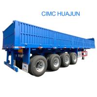 China Hot 4 Axles Flatbed Semi Trailer with 1000mm Sidewall Max Payload of 60T 12.00R20 Tire for sale