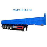 China Hot 4 Axles Flatbed Semi Trailer with 1000mm Sidewall Max Payload of 60T 12.00R20 Tire for sale