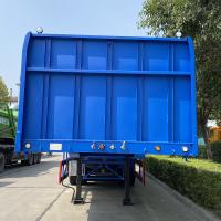 China Hot 4 Axles Flatbed Semi Trailer with 1000mm Sidewall Max Payload of 60T 12.00R20 Tire for sale