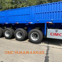 China Hot 4 Axles Flatbed Semi Trailer with 1000mm Sidewall Max Payload of 60T 12.00R20 Tire for sale