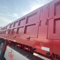 China 60T Max Payload 3 Axles Flatbed Semi Trailer with Side Door and Sidewall Cargo Fence for sale