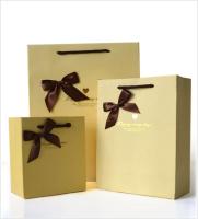 China Custom Navy Blue Luxury Packaging Bags with Gold Foil Printing and Satin Bow Detail - OEM/ODM Wholesale for sale
