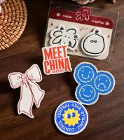 China Embossed Cotton Paper Souvenir Badges With Metal Backing For Clothing for sale