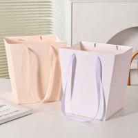China Trapezoidal Paper Flower Bags with Ribbon Handles for Gift Packaging for sale