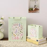 China Floral Printed Paper Gift Bags with Rope Handles for Retail Packaging for sale