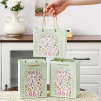 China Floral Printed Paper Gift Bags with Rope Handles for Retail Packaging for sale