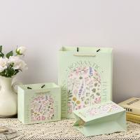 China Floral Printed Paper Gift Bags with Rope Handles for Retail Packaging for sale