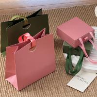 China Ribbon Handle Paper Gift Bags with Die Cut Closure for Retail for sale
