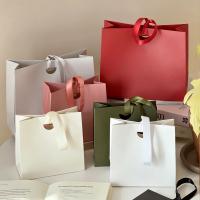 China Ribbon Handle Paper Gift Bags with Die Cut Closure for Retail for sale
