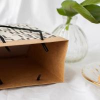 China Kraft Paper Shopping Bag with Rope Handle for Retail Packaging for sale