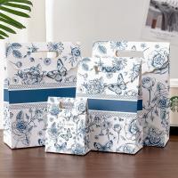 China Floral Printed Paper Gift Bags with Die Cut Handle and Flap Top for sale