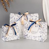 China Vintage Floral Paper Gift Bags with Ribbon Closure for Boutique Retail for sale