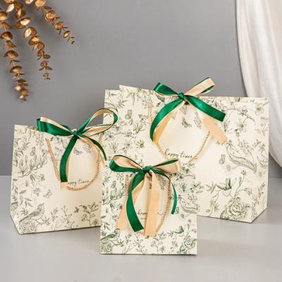 China Vintage Floral Paper Gift Bags with Ribbon Closure for Boutique Retail for sale