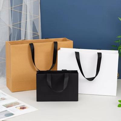 China Paper Shopping Bags with Wide Ribbon Handles for Boutique Retail Packaging for sale