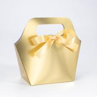 China Paper Gift Bags With Die-Cut Handle And Ribbon Bow For Retail Packaging for sale