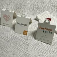 China Folded Paper Sock Tags With Euro Hole And Barcode For Retail Hosiery Display for sale