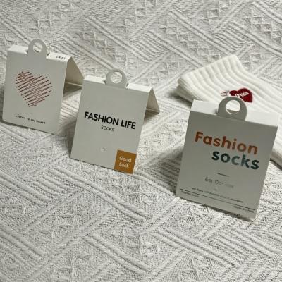 China Folded Paper Sock Tags With Euro Hole And Barcode For Retail Hosiery Display for sale