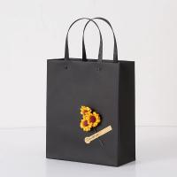 China Kraft Paper Gift Bags With Handle And Decorative Flowers For Retail Packaging for sale
