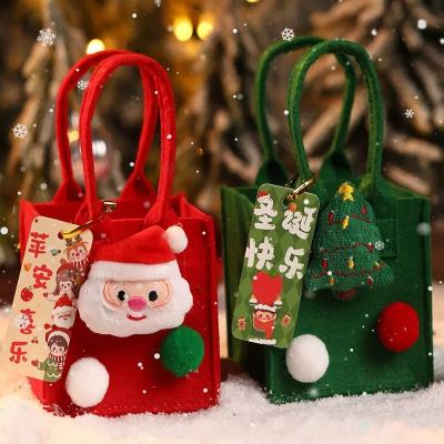 China Christmas Felt Gift Bags With Plush Holiday Ornaments For Seasonal Gifting for sale