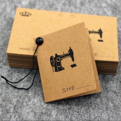 China Kraft Paper Folded Hang Tags With Care Instructions For Apparel Branding for sale