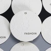 China Embossed Round Paper Hang Tags With Relief Floral Pattern For Apparel Branding for sale
