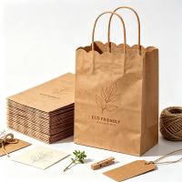China Scalloped edge kraft paper party loot bag with twisted handles for favors for sale