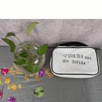 China Elegant White Floral Pattern Large Capacity Washable Travel Cosmetic Bag with Zipper for sale