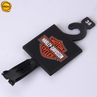 China Customized Printed Black Plastic Belt Hangers With Stickers for sale