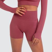 China Seamless sports solid color tight shorts high waist elastic hip fast dry fitness yoga pants woman for sale