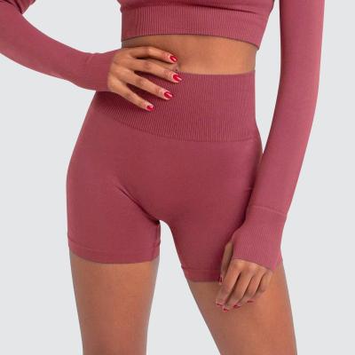 China Seamless sports solid color tight shorts high waist elastic hip fast dry fitness yoga pants woman for sale