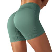 China Seamless solid-color threaded peach buttocks yoga three-minute shorts sports running fitness pants women for sale