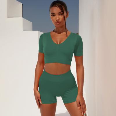 China Solid-color running workout wear five-piece women's knitted seamless yoga suit with buttocks for sale