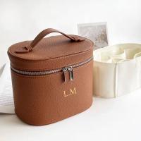 China Custom Logo Leather Travel Makeup Case Toiletry Bag With Removable Compartment for sale