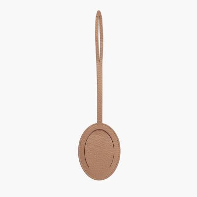 China OEM PU Leather Luggage Tags Oval Shape Custom Logo Suitcase Name Tags for sale