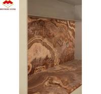 China Polished Translucent Natural Tiger Red Onyx Marble for Modern Backlit Jade Hotel Design for sale