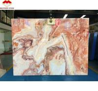 China Backlit Red Onyx Marble Stone Book Matched Slab for Transparent Marble Table Pattern for sale