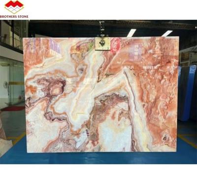 China Backlit Red Onyx Marble Stone Book Matched Slab for Transparent Marble Table Pattern for sale