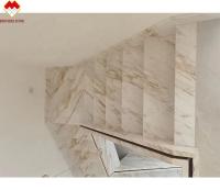 China Customized Size Venus Gold Calacatta Marble Spiral Staircase Tread Indoor Modern LED Light and Anti-Slip Design for sale
