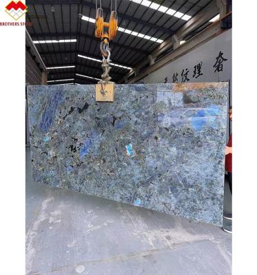 China Big Slab Polished Shinning Labradorite Blue Granite Countertop and Island Table Design for sale