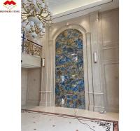 China Blue Golden Onyx Stone Slabs Natural Translucent Marble for TV Background Wall Panels for sale