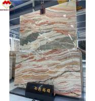 China Competitive Onyx Stone Veneer Book Match Colorful Onyx Flooring Tile Backlit Rainbow for sale