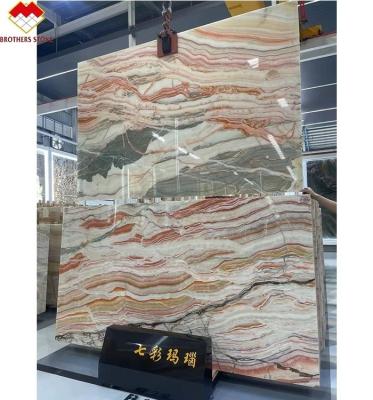 China Competitive Onyx Stone Veneer Book Match Colorful Onyx Flooring Tile Backlit Rainbow for sale