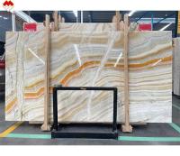 China Competitive Onyx Stone Veneer Book Match Colorful Onyx Flooring Tile Backlit Rainbow for sale