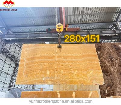 China Thickness Tolerance /- 1mm Antique Book Match Yellow Onyx Marble for Lavabo Component for sale