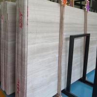 China 2018 Wholesale low price wood grain glazed sunny grey marble for sale