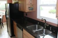China 14.5 Mpa Natural Tan Brown Granite Stone Tiles For Steps for sale