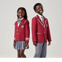 China Structured Red Blazer School Uniform Set with Contrast Piping and Chest Badge Placement for sale