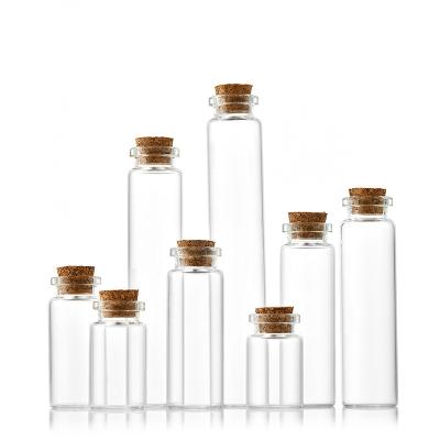 China 30ml/50ml/100ml Glass Bottles with Natural Cork Stoppers and Optional Decoration for Eco-Friendly Cosmetic Packaging for sale